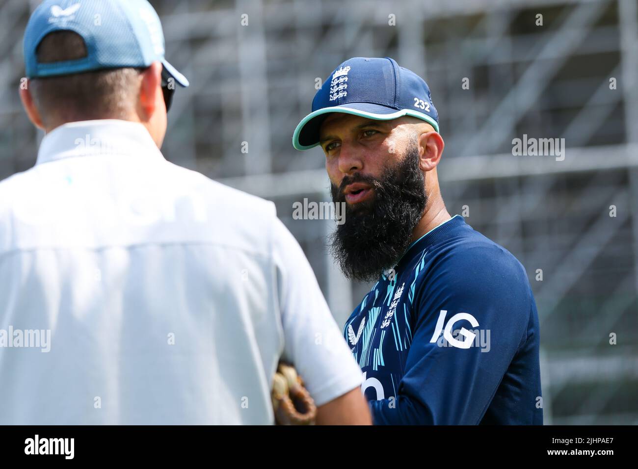 England's Moeen Ali chats with England coach Matthew Mott during a ...