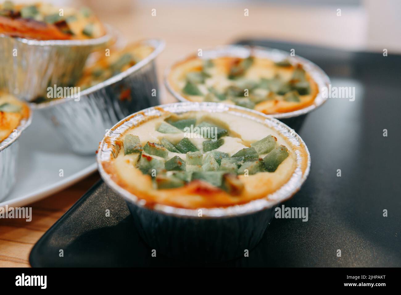 Sweet cupcakes with candied fruits close-up. We cook at home Stock ...