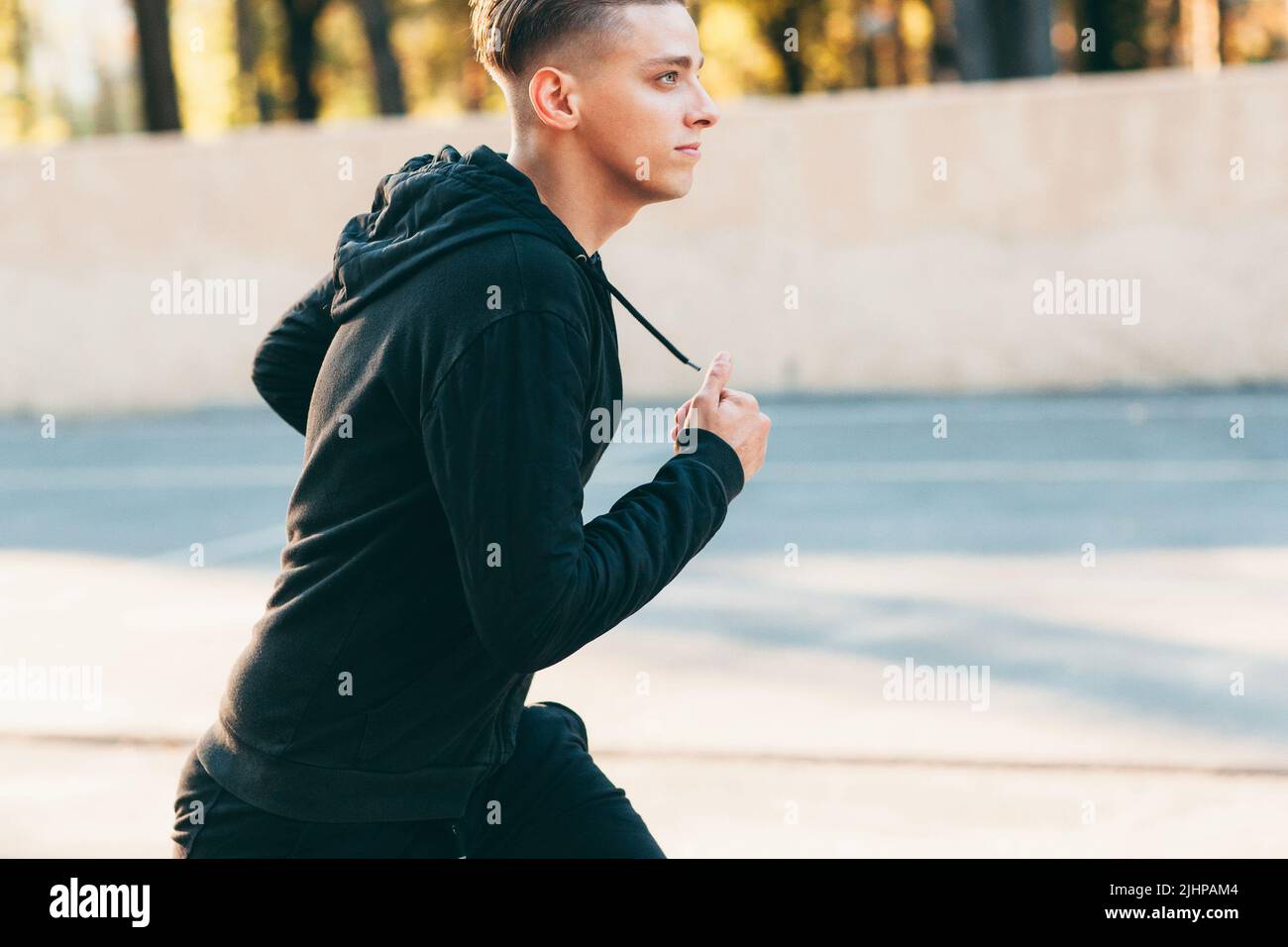 Side view portrait of exercising man outside Stock Photo - Alamy