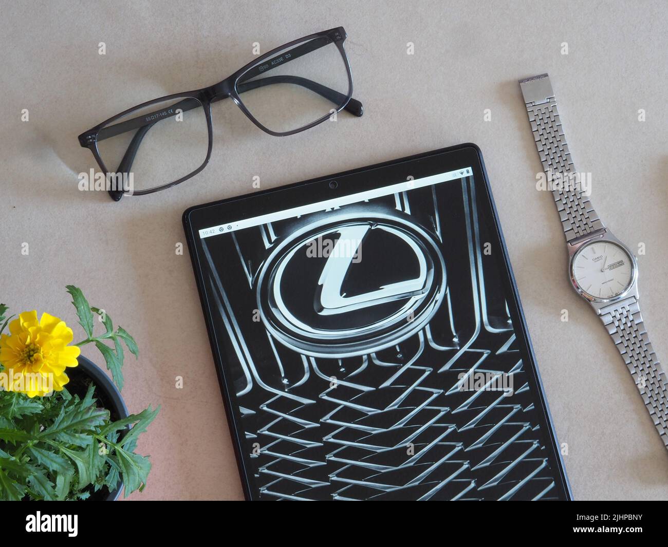 In this photo illustration, Lexus logo seen displayed on a tablet Stock ...