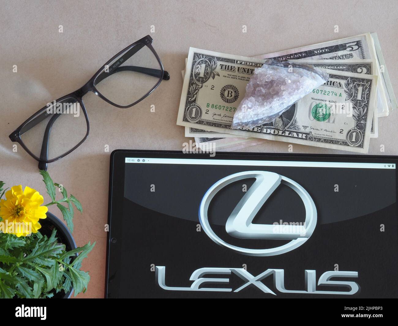 In this photo illustration, Lexus logo seen displayed on a tablet Stock ...