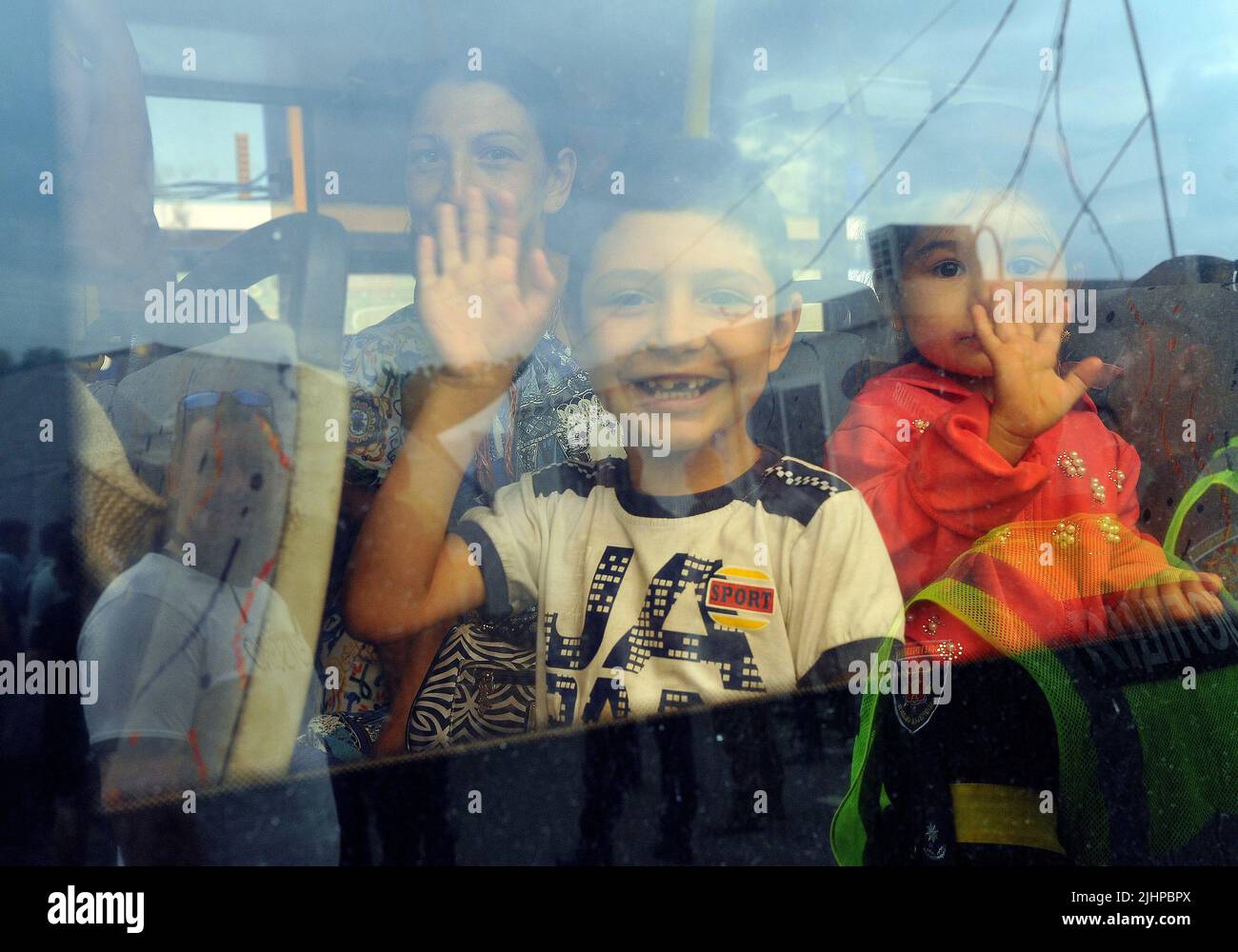 Non Exclusive: ZAPORIZHZHIA, UKRAINE - JULY 17, 2022 - Children sit on ...