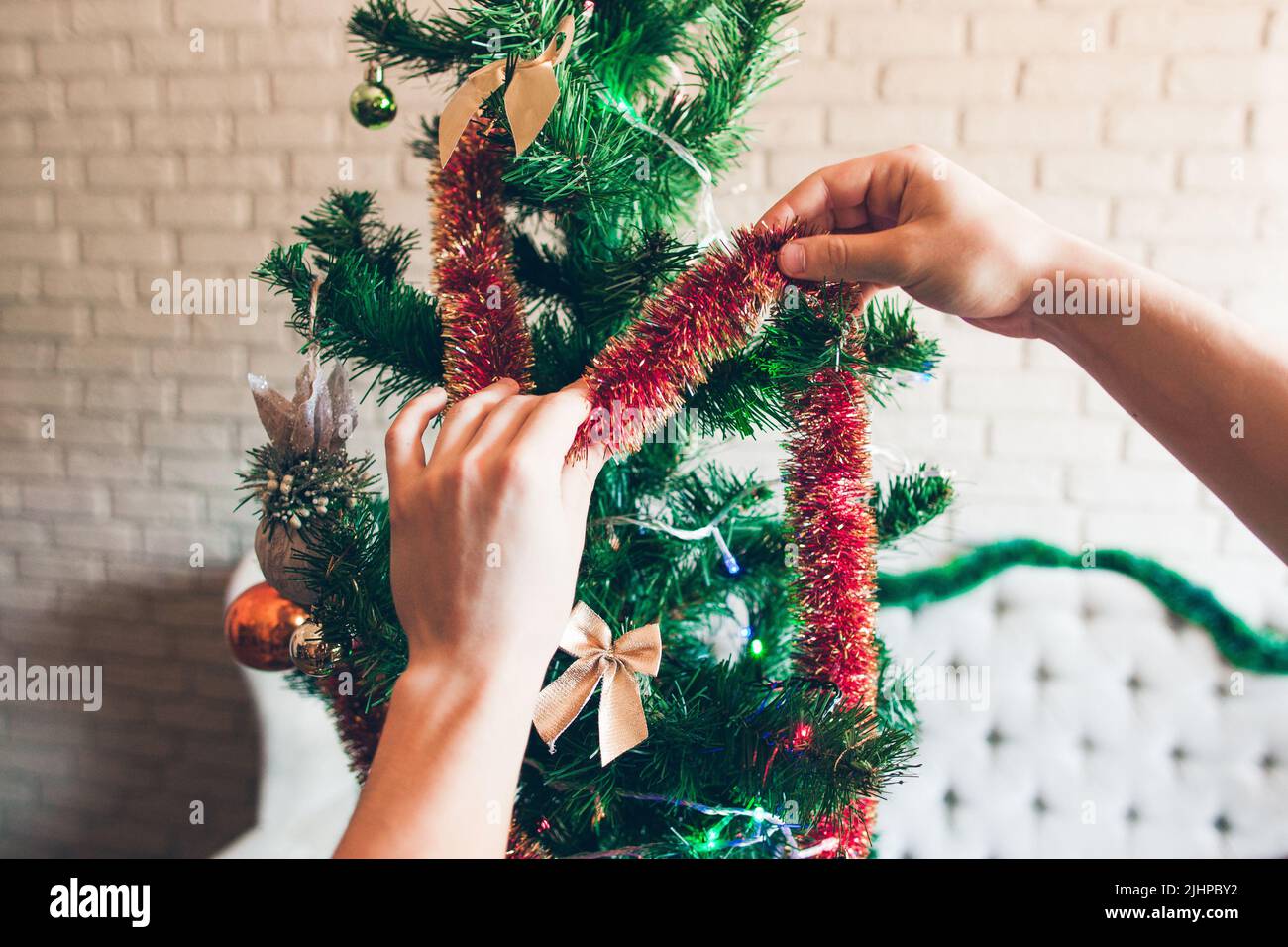 Hand decorating tree hi-res stock photography and images - Alamy