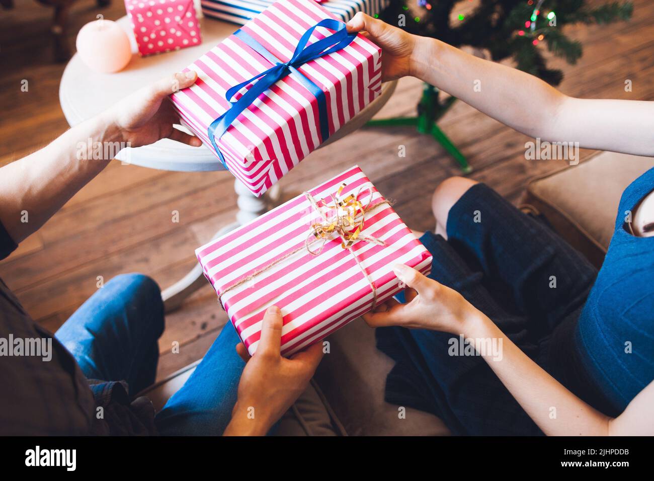 Couple giving gifts for each other Stock Photo - Alamy
