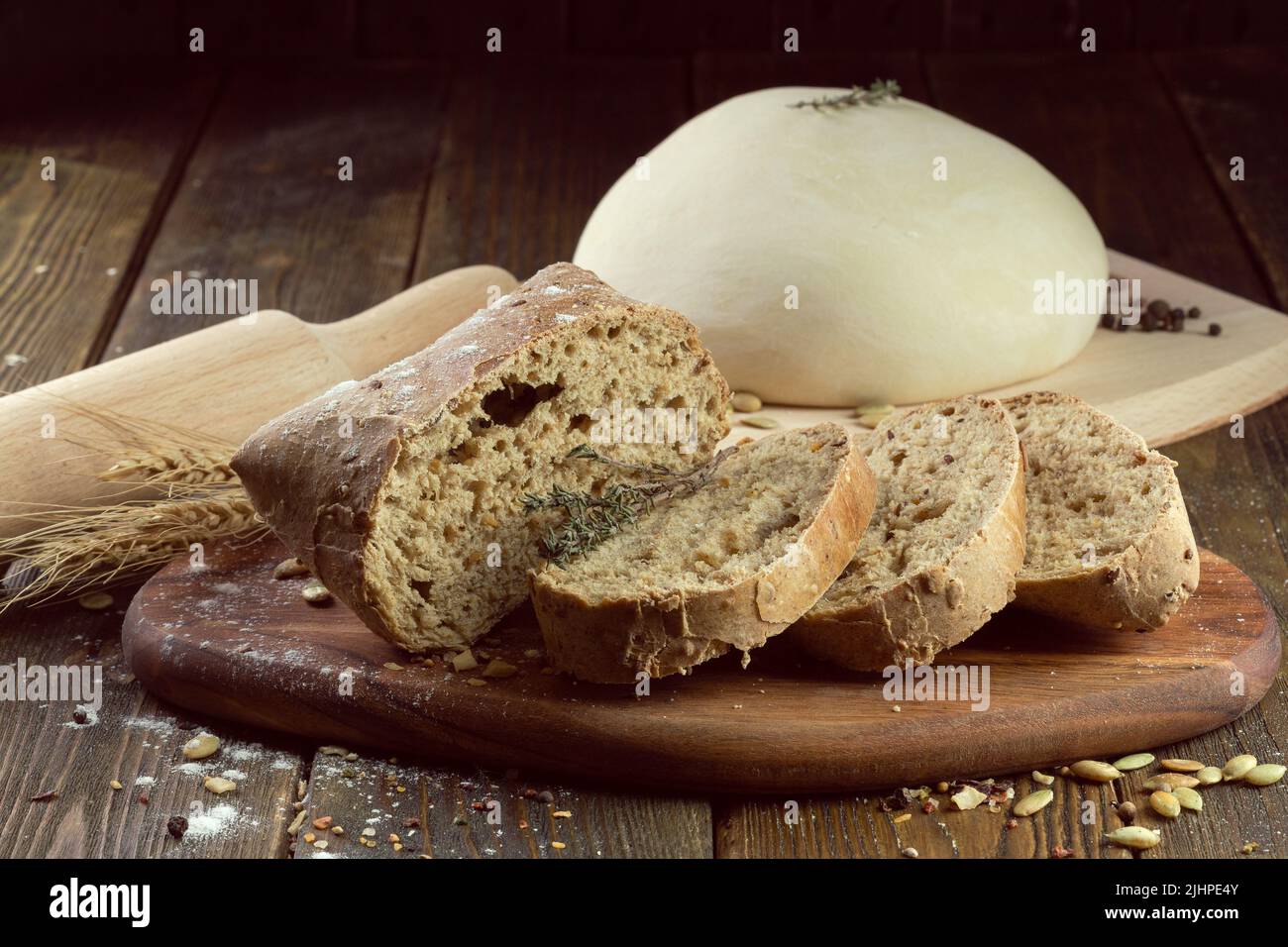 baked bread on wooden table background Stock Photo - Alamy