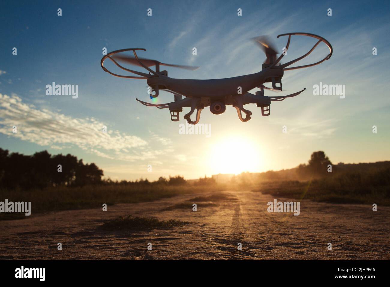 Drone flying outdoor in evening, sunset background Stock Photo - Alamy