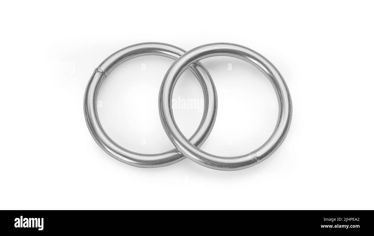 Two crossed silver colored crossed metallic rings. Steel rings isolated ...
