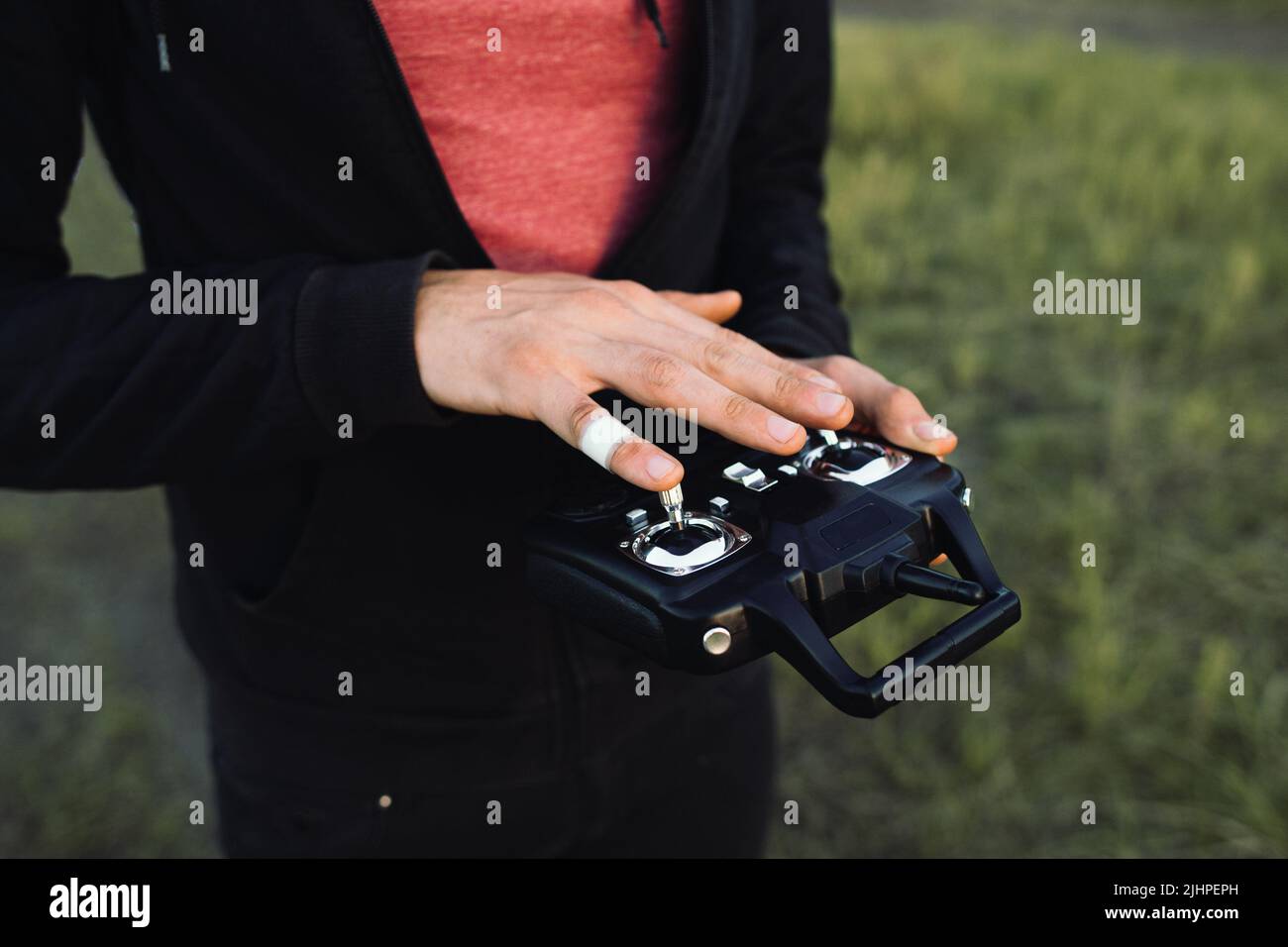 Man touching remote controller closeup, free space Stock Photo - Alamy