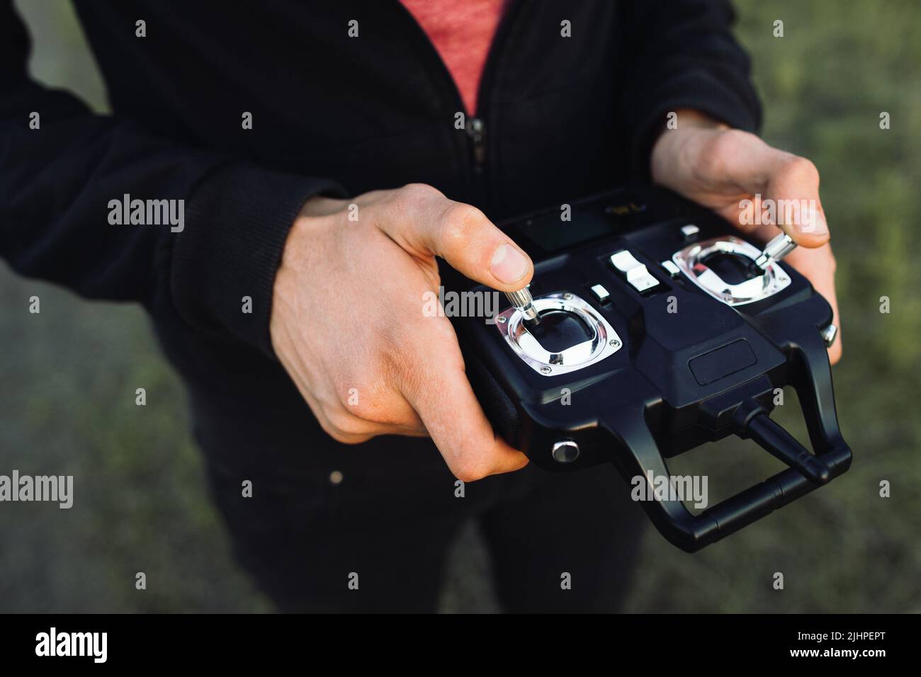 Remote controller in male hands close-up Stock Photo - Alamy