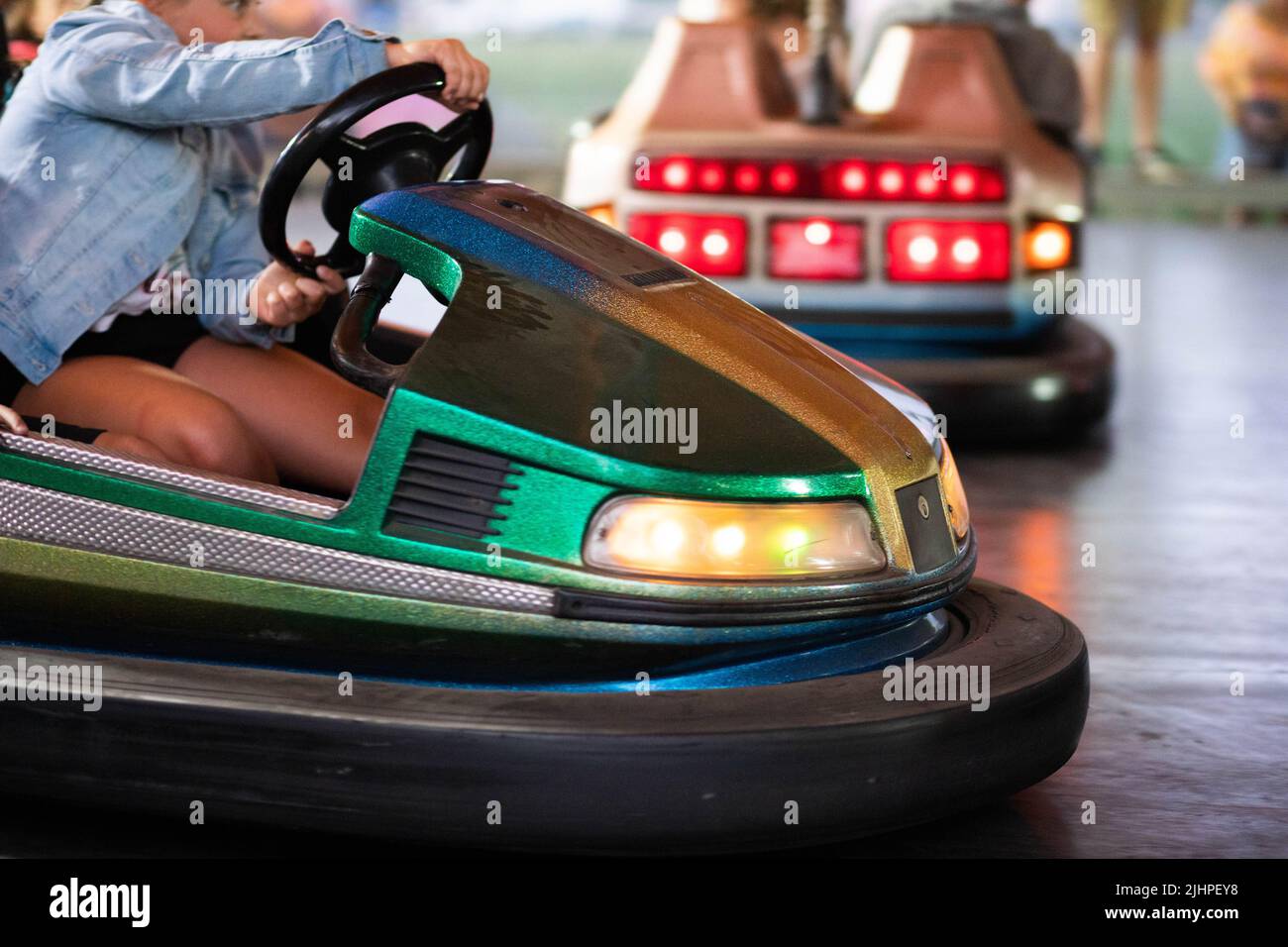 bumper cars close up people having fun Stock Photo - Alamy