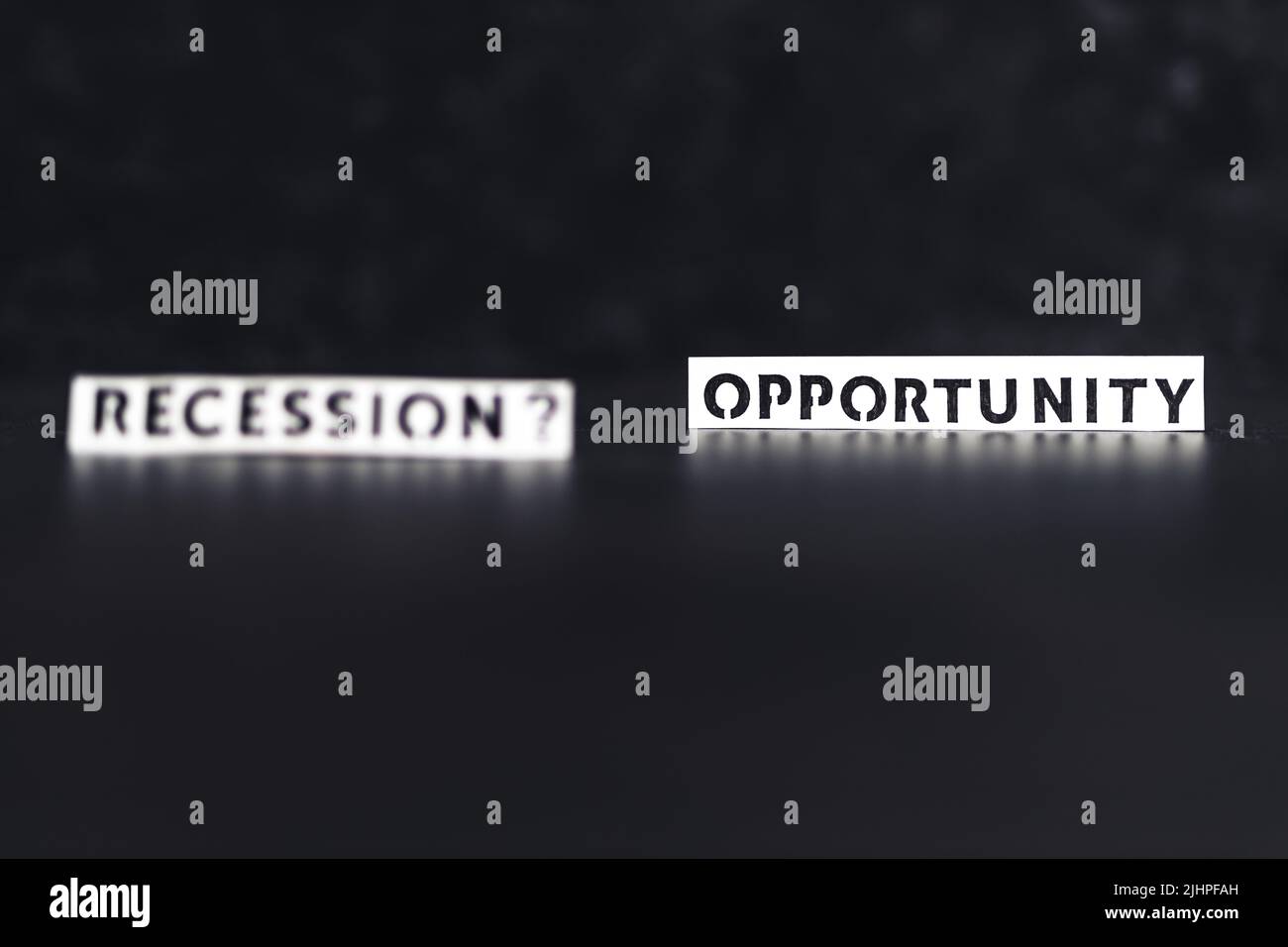recession or opportunity texts over dark background with only one in ...