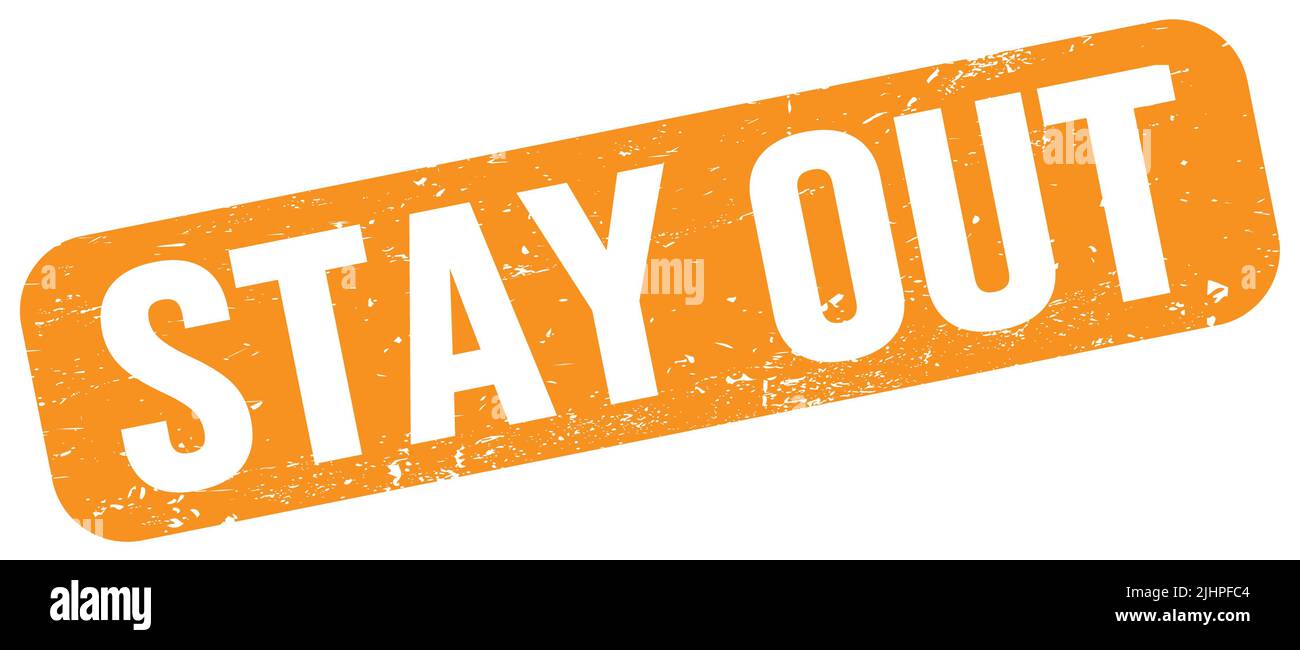 STAY OUT text written on orange grungy stamp sign Stock Photo - Alamy