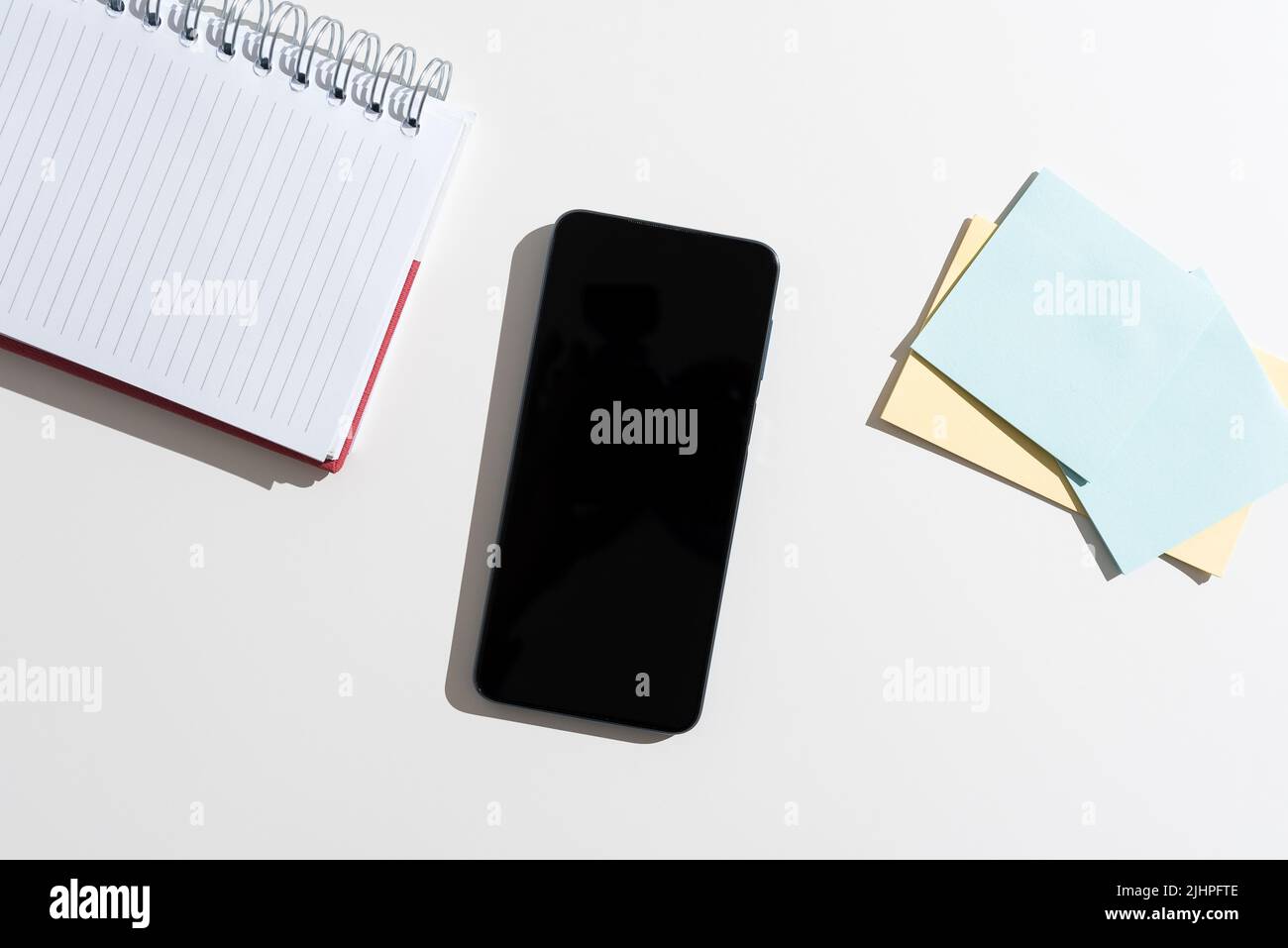 Mobile Phone With Important Message On Desk With Empty Notebook And ...