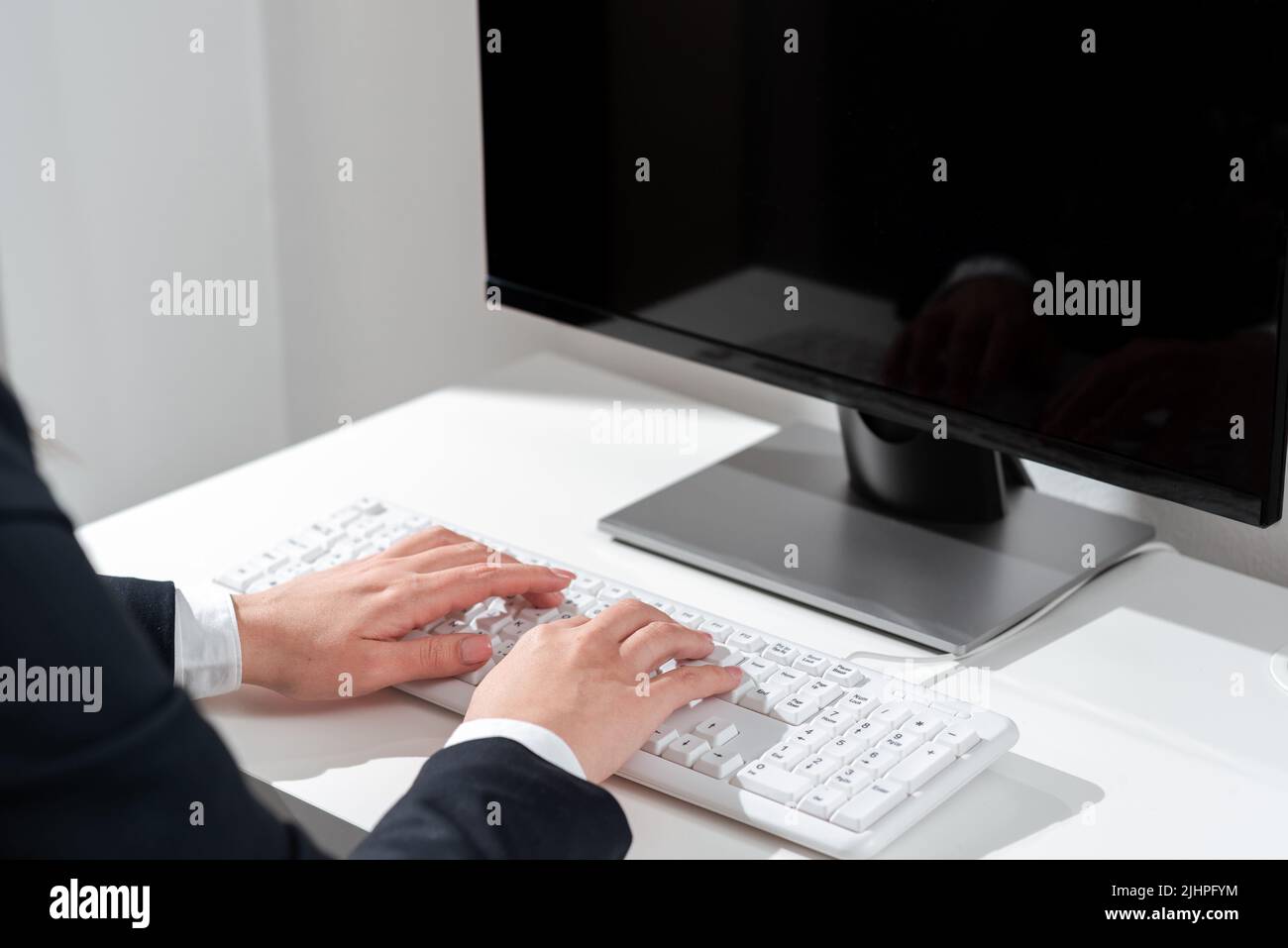 Businesswoman Typing Recent Updates On Lap Top Keyboard On Desk. Woman ...
