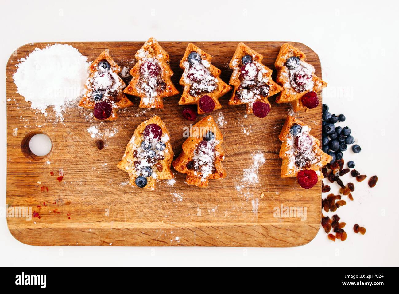 Christmas tree cookies with berries flat lay Stock Photo - Alamy