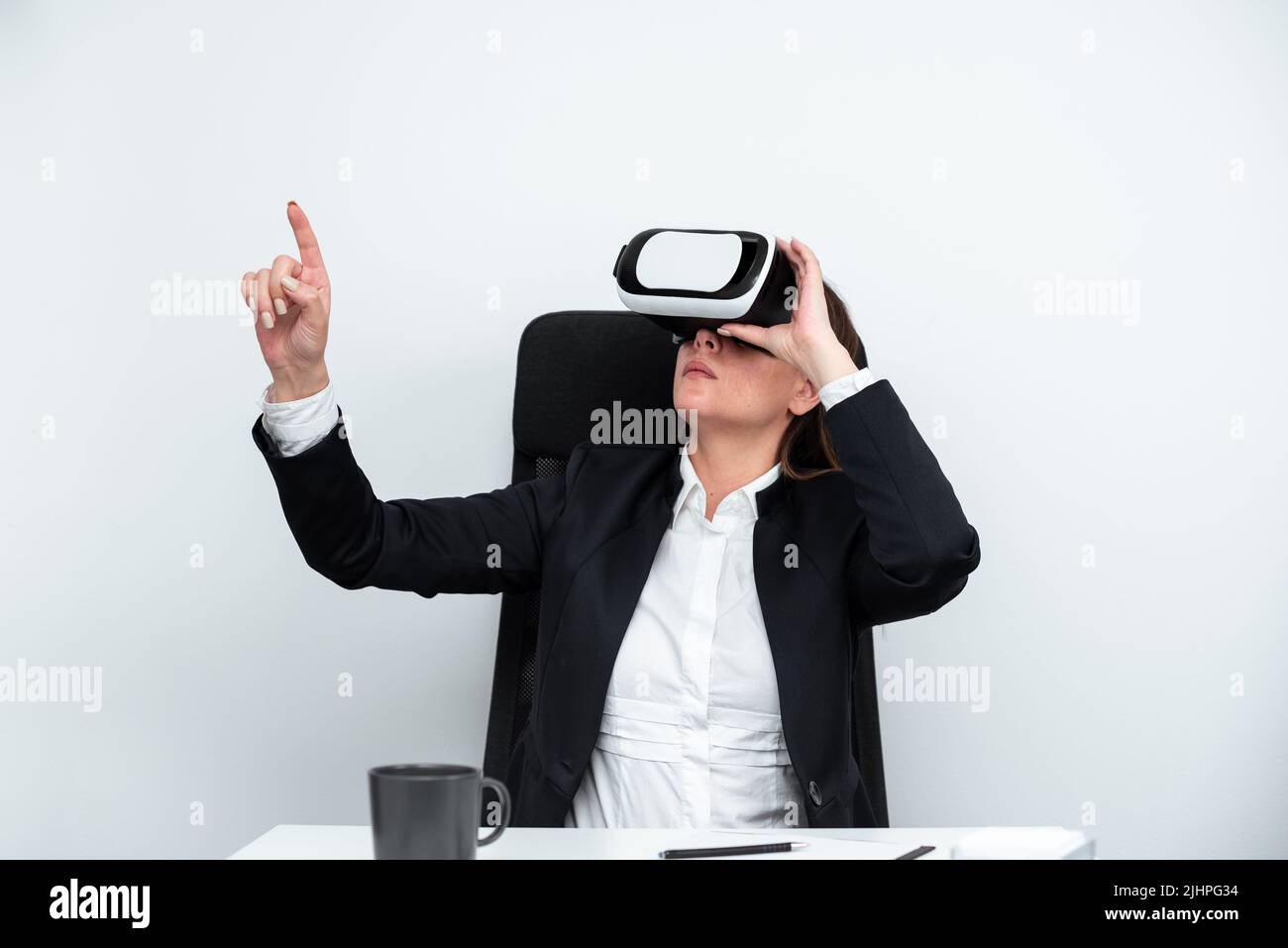 Female Executive Gesturing While Learning Professional Skill Through ...