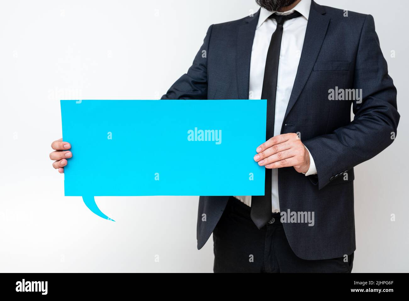 Businessman Holding Speech Bubble With Important Messages. Man In Suit ...