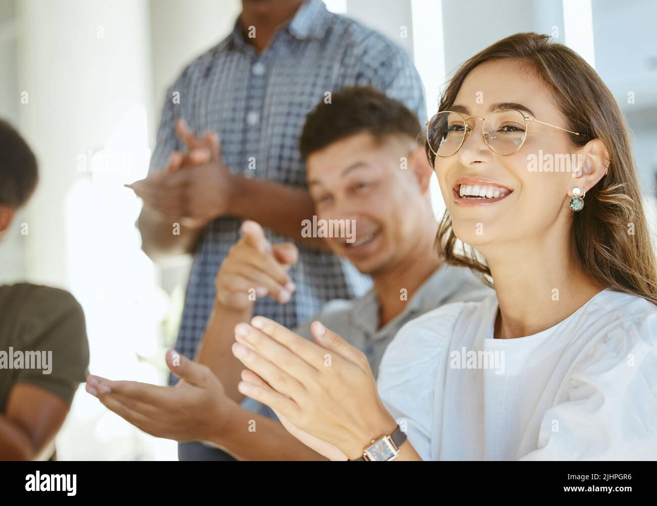 Group of joyful diverse businesspeople clapping hands in support during ...