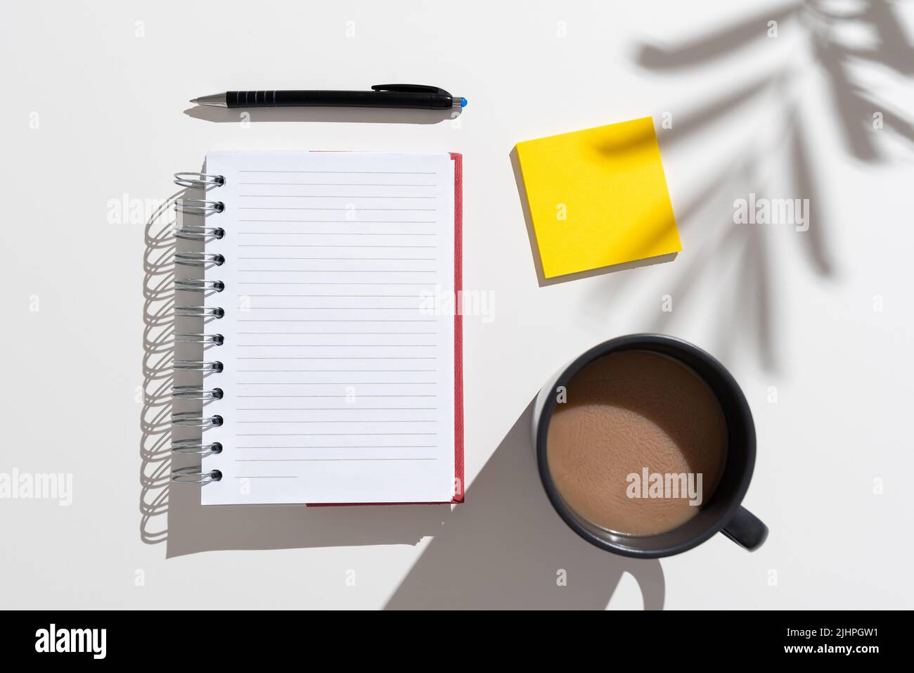Notebook With Important Messages On Desk With Coffee, Notes And Pen ...