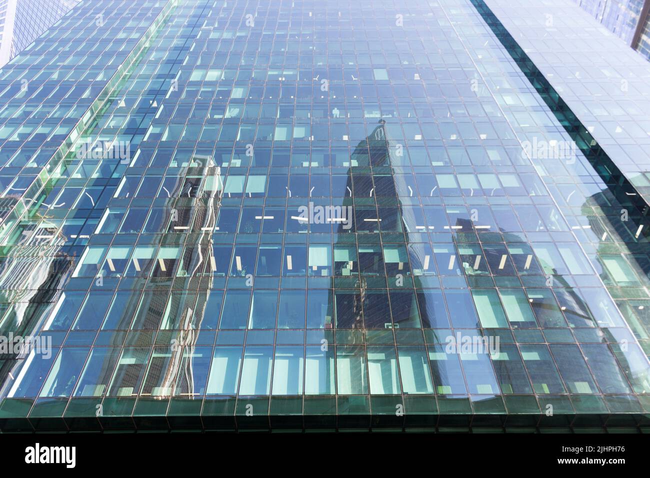 Glass facade of a modern office building. Office cells. Urban landscape ...