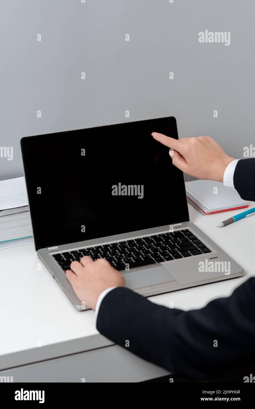 Businesswoman Typing Recent Updates On Lap Top Keyboard On Desk And ...