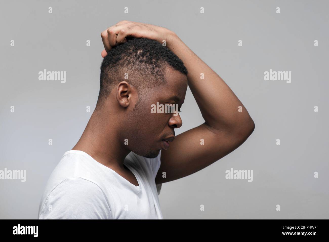 African man thinking. Concentrated on thoughts Stock Photo - Alamy