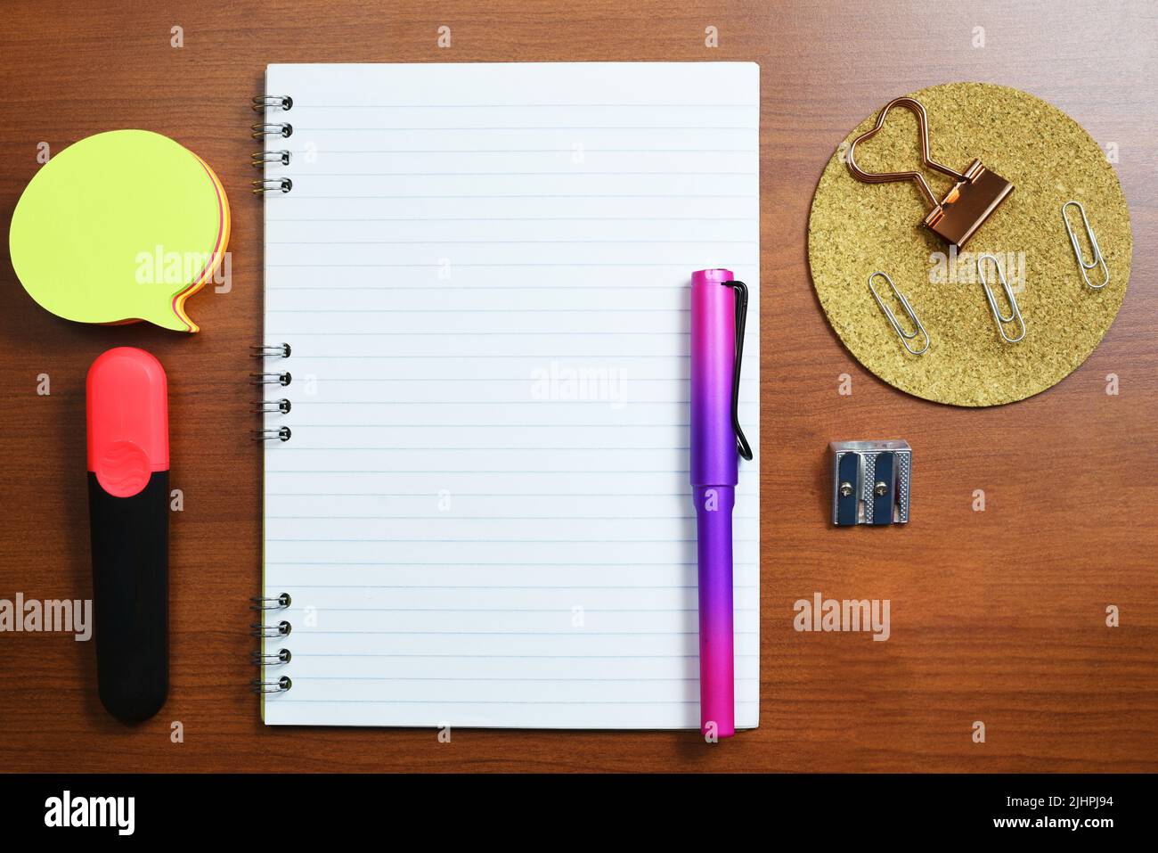 Notebook With Important Message On Desk With Pen, Sharpener, Notes ...