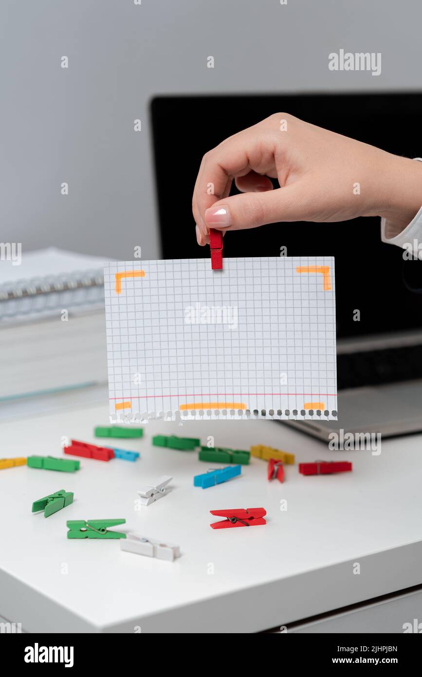 Businesswoman Holding Important Message On Note Over Desk With Lap Top ...