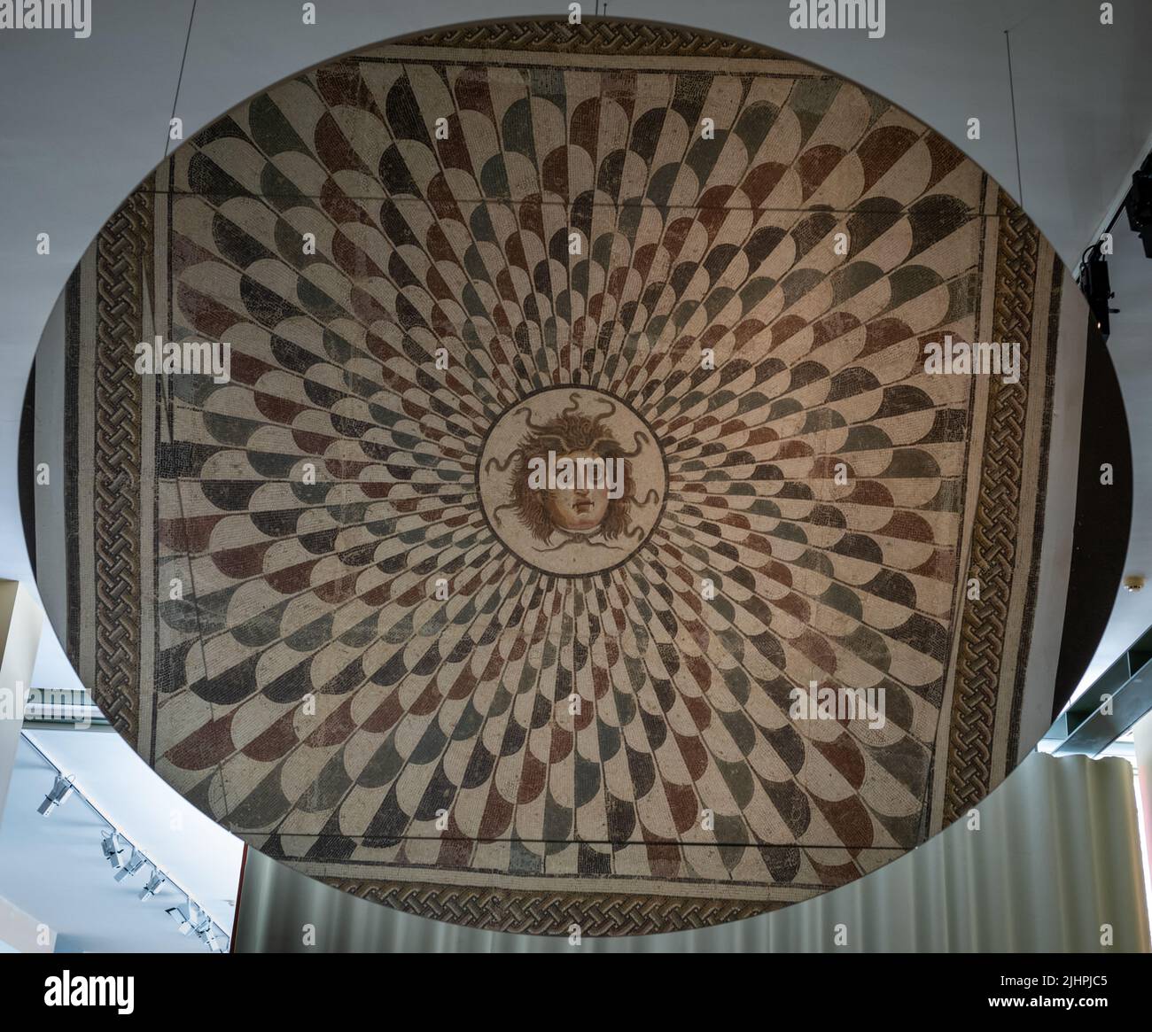 A large Roman mosiac is reflected in a mirror to help visitors see its ...