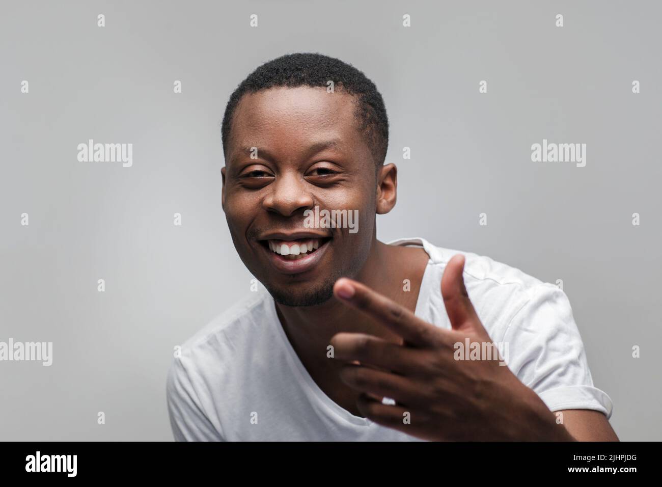 T shirt black smiling grey background hi-res stock photography and ...