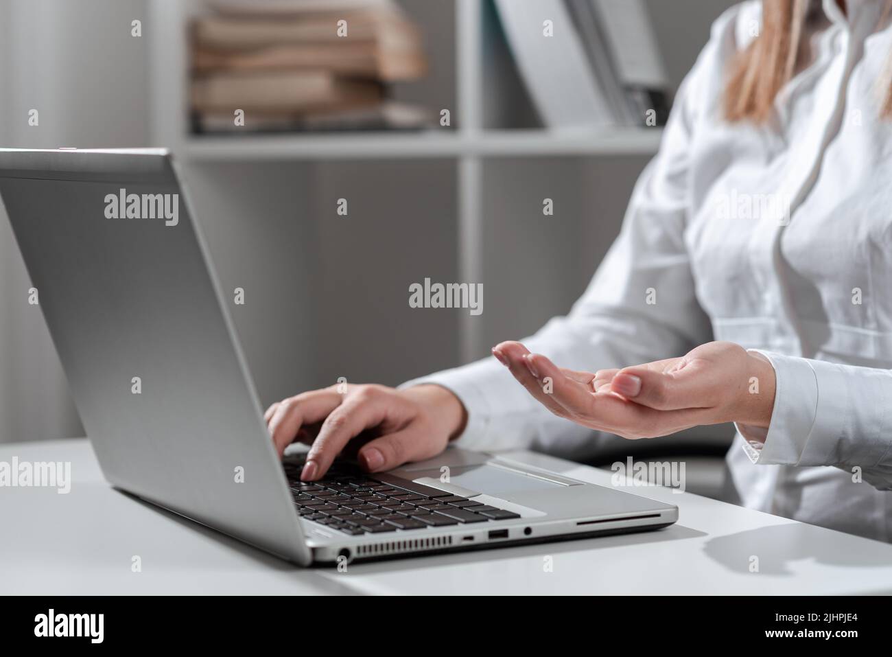 Businesswoman Typing Recent Update On Lap Top Keyboard On Desk And ...