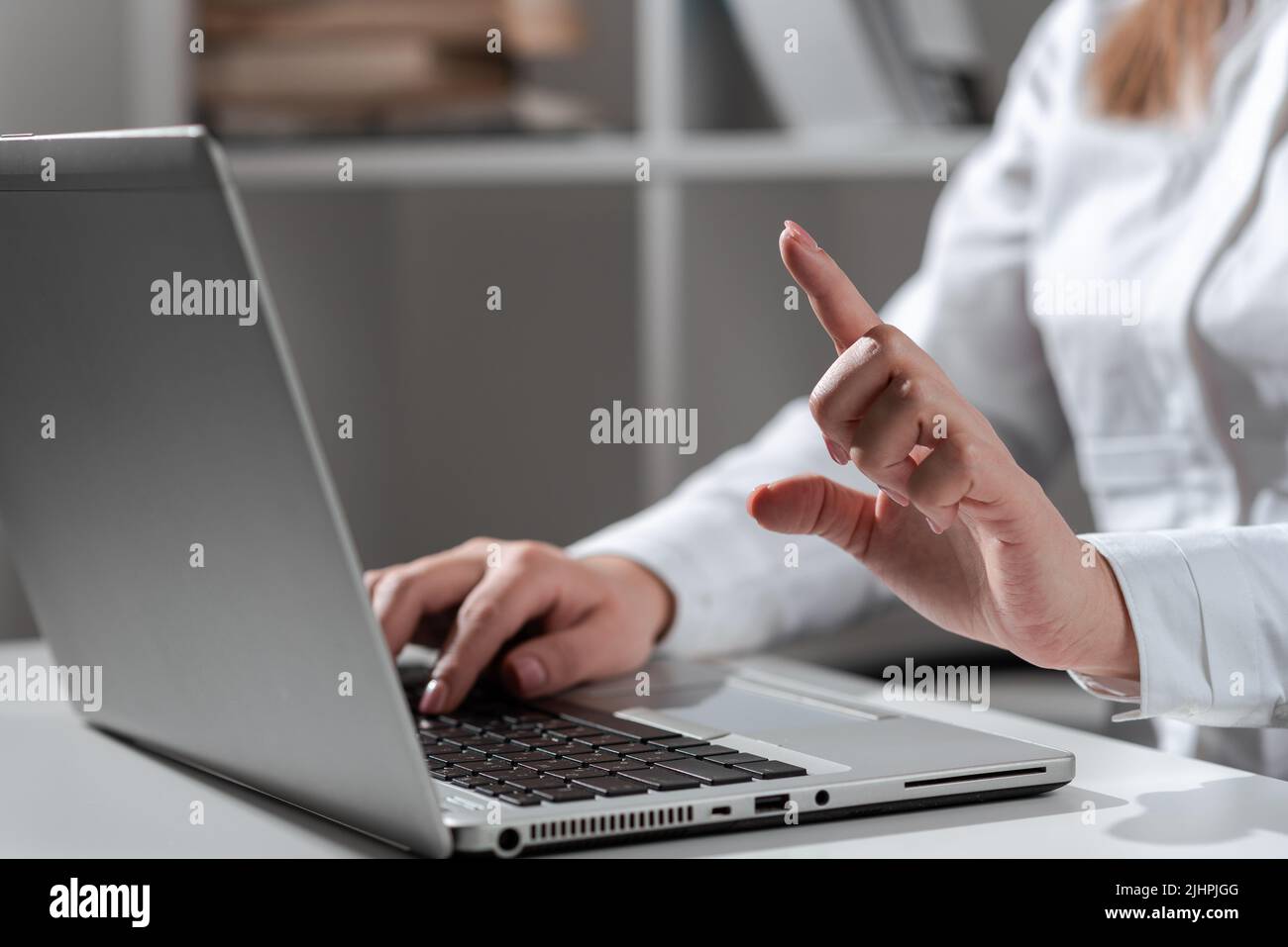 Businesswoman Typing Recent Updates On Lap Top Keyboard On Desk And ...
