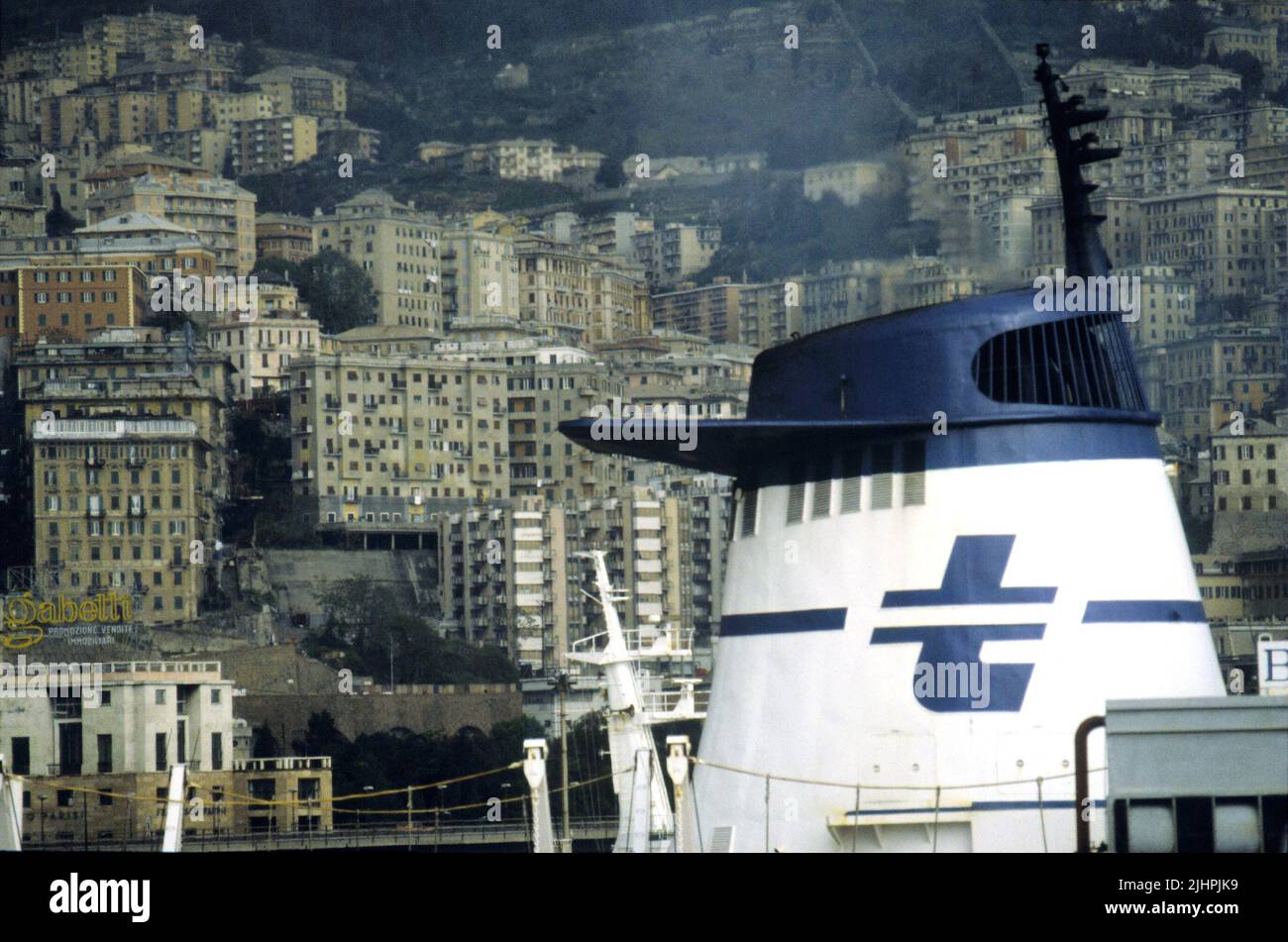 Genoa (Italy), historical downtown and funnel of a ferry Stock Photo ...