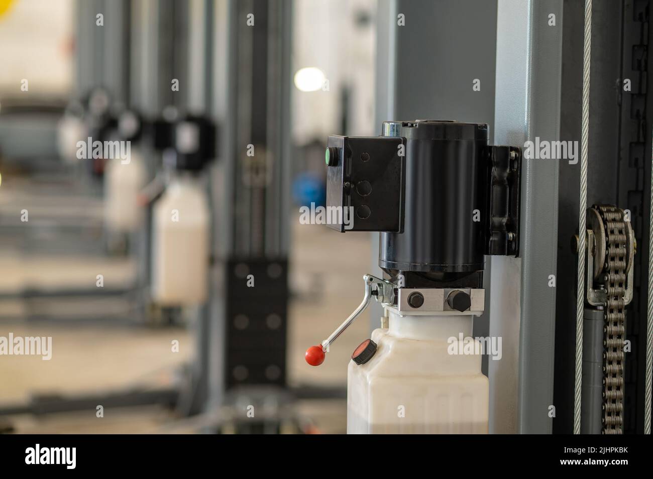 Hydraulic station on car lift stand Stock Photo - Alamy