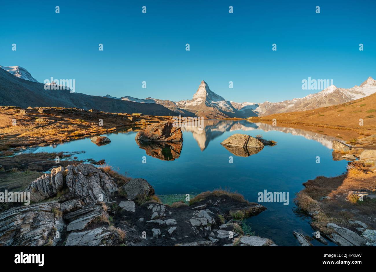 Panoramic morning view of Lake Stellisee with the Matterhorn Cervino ...