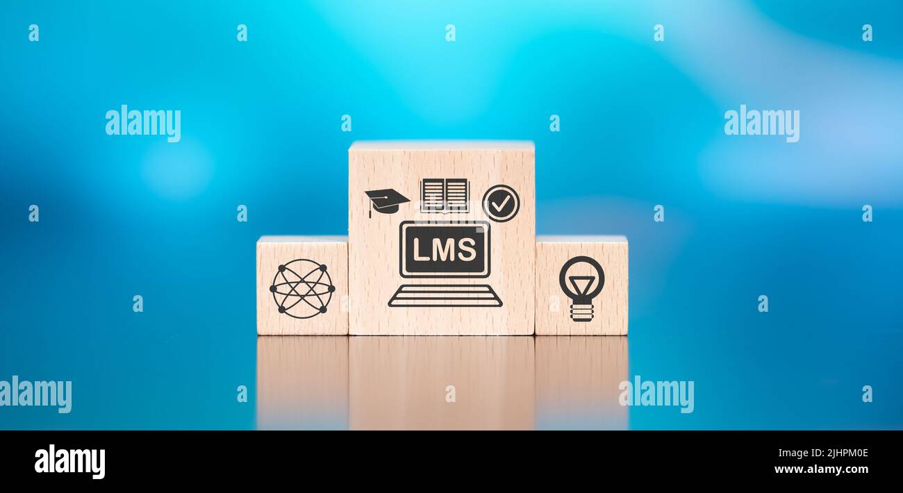 Wooden blocks with symbol of lms concept on blue background Stock Photo ...