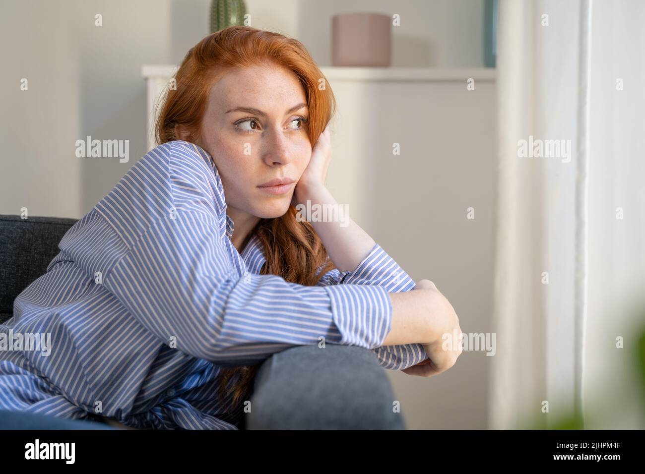 Depressed woman sofa hi-res stock photography and images - Alamy