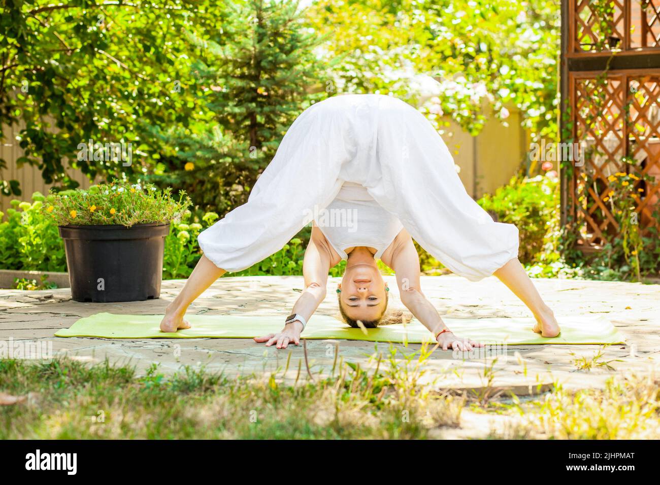 Wide stance forward bend pose yoga hi-res stock photography and images ...