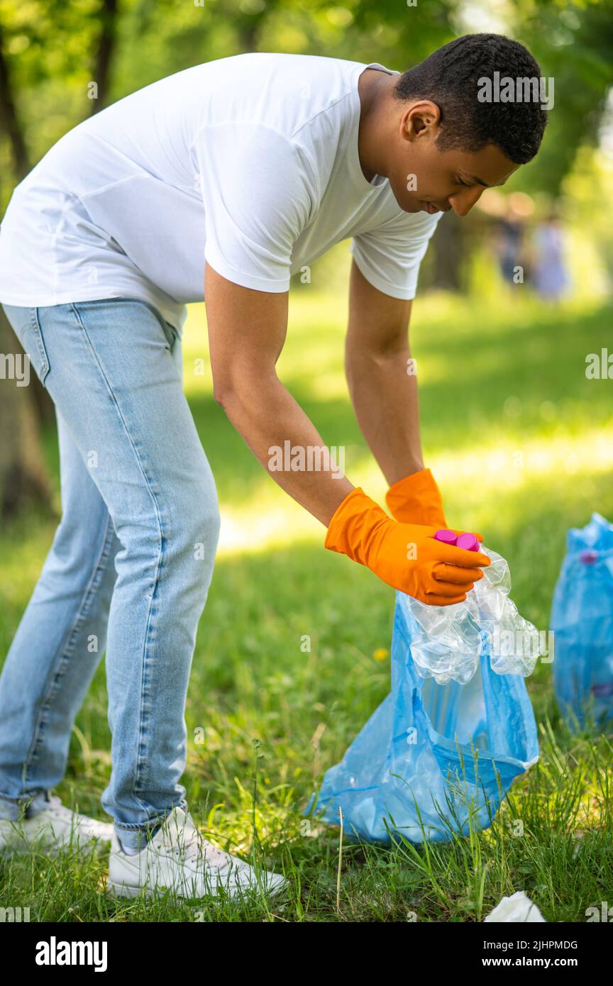 Recycling man putting waste hi-res stock photography and images - Alamy