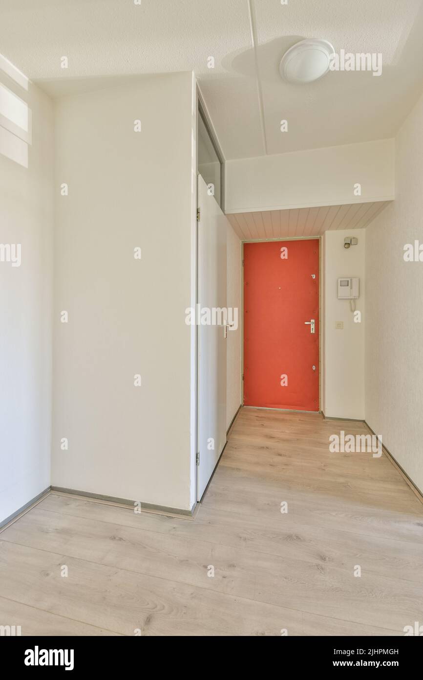 Room with door and narrow long corridor in perspective in modern house ...
