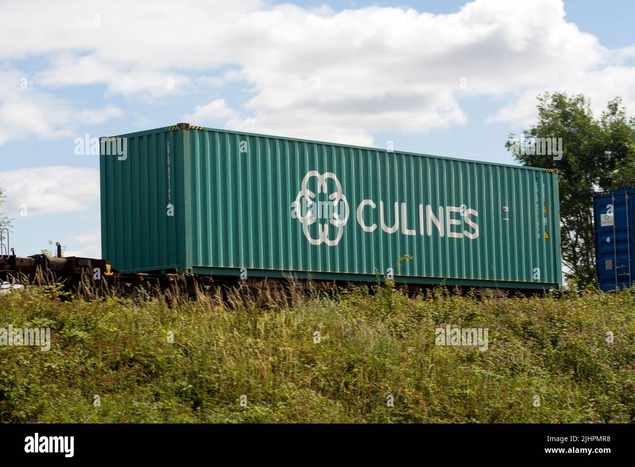 A Culines shipping container on a freightliner train, Warwickshire, UK ...