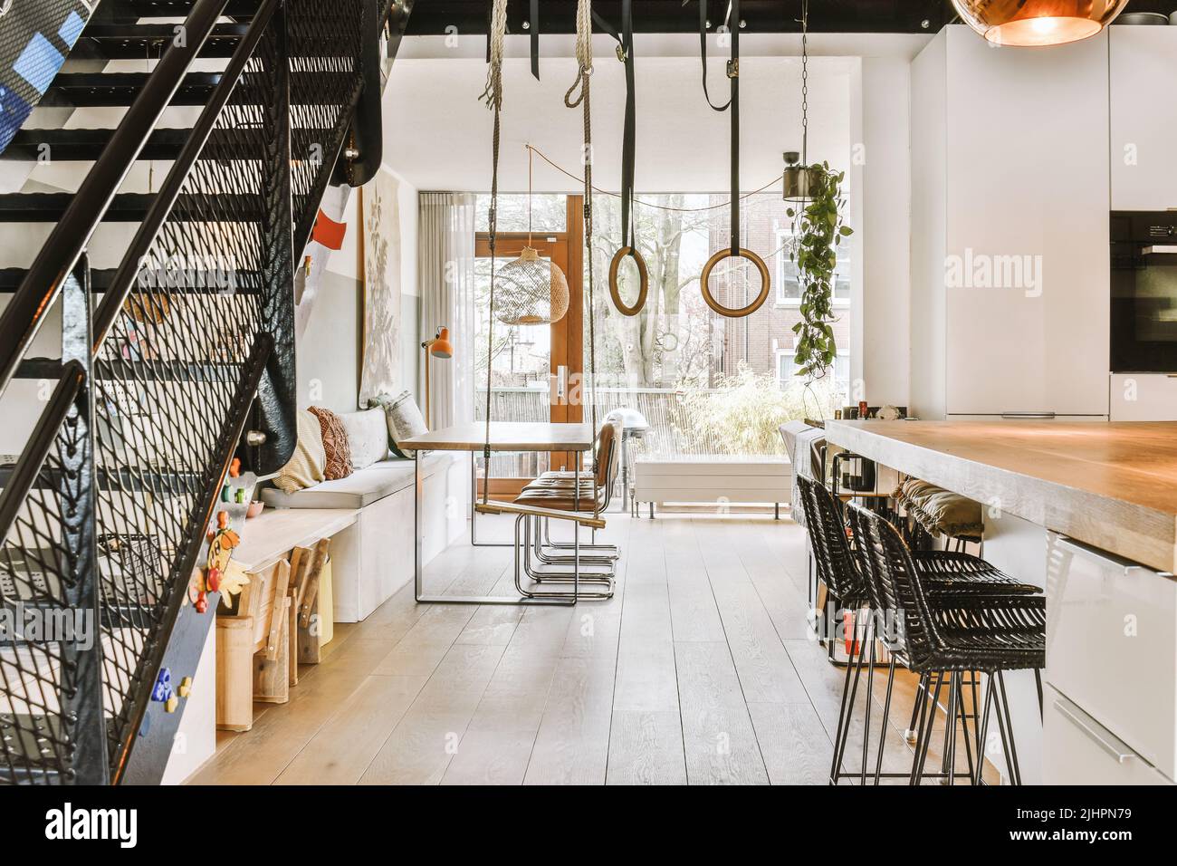 Interior of light kitchen and dining room in contemporary apartment at ...