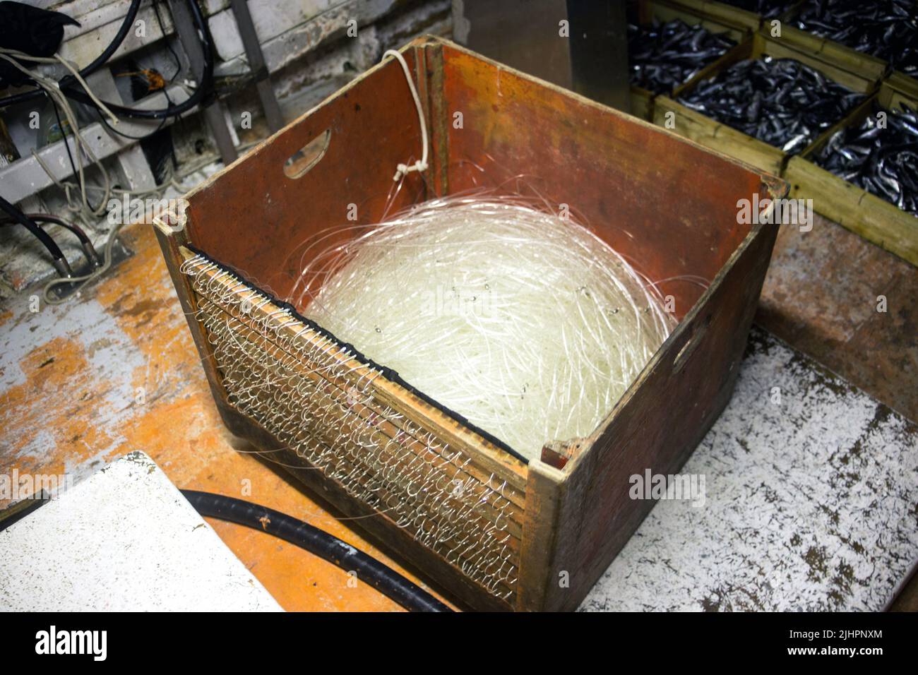 Longline hook boxes Stock Photo - Alamy