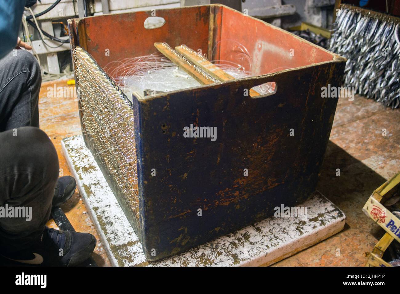 Longline hook boxes Stock Photo - Alamy