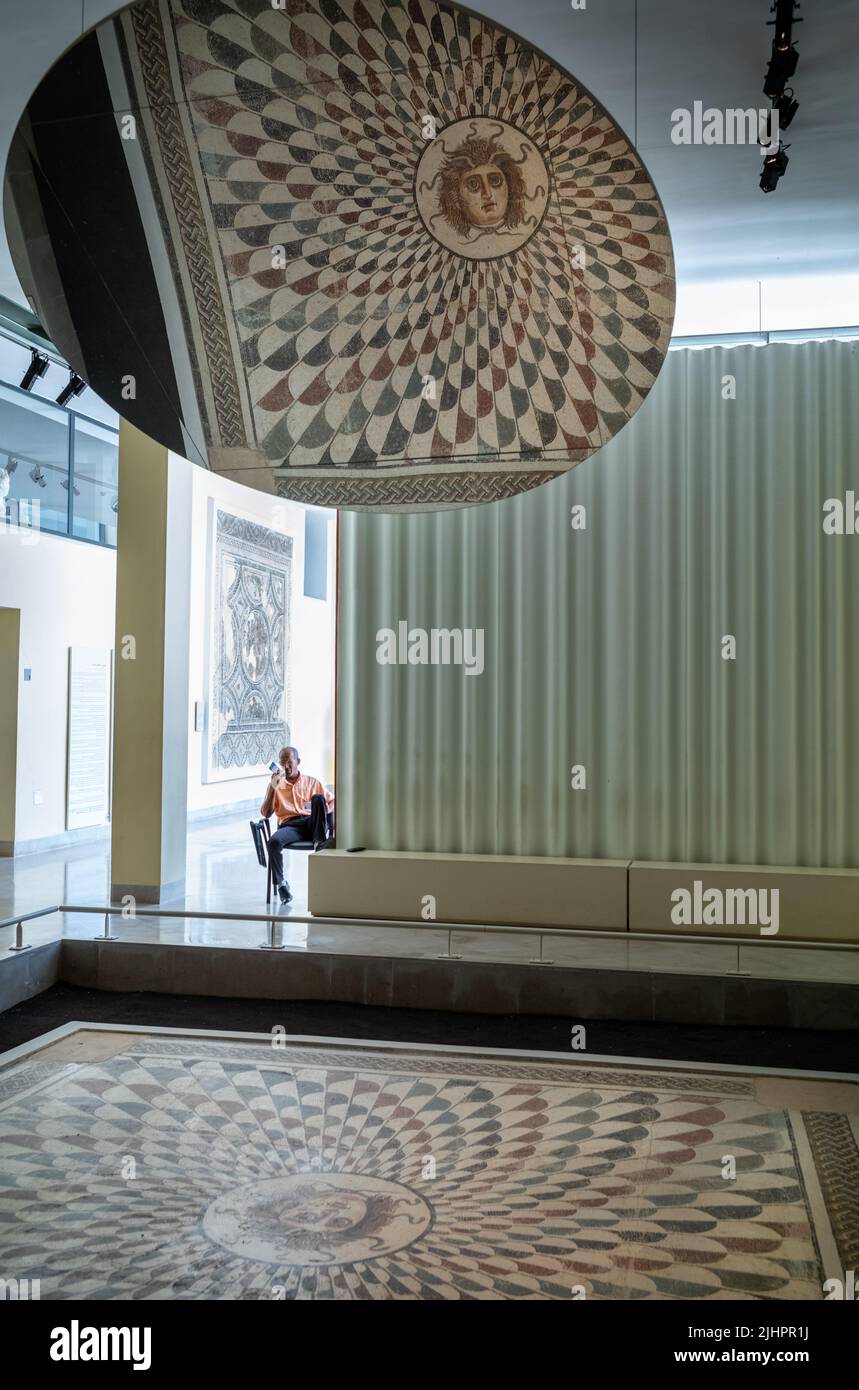 A large Roman mosiac is reflected in a mirror to help visitors see its ...