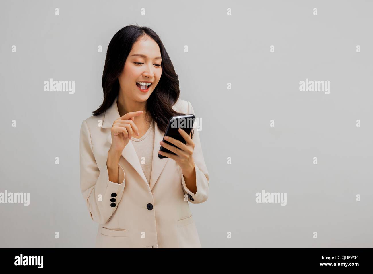 business woman clicks on the smartphone screen. isolated white ...