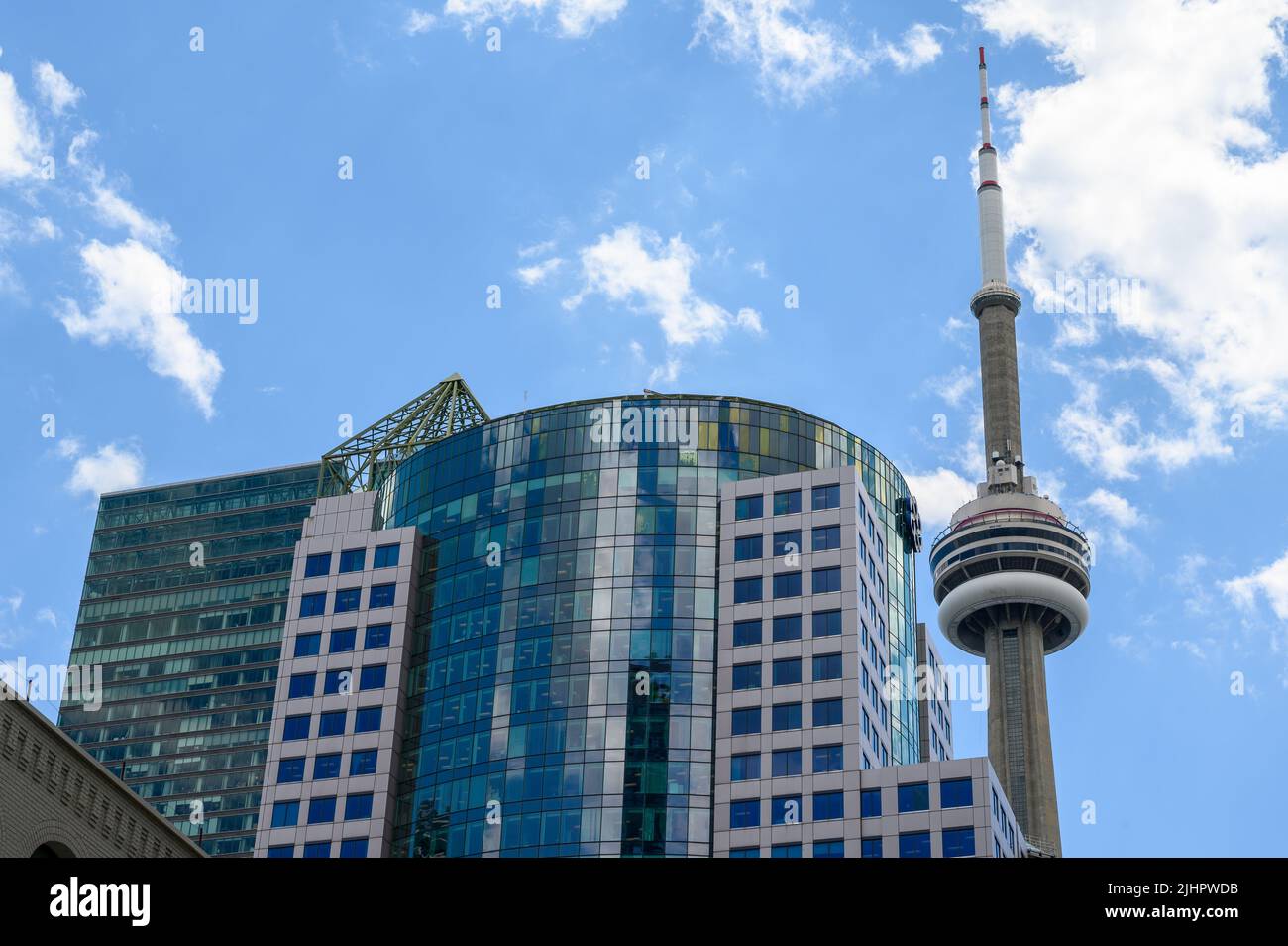 CN Tower rising up behind an office block in downtown Toronto, Ontario ...