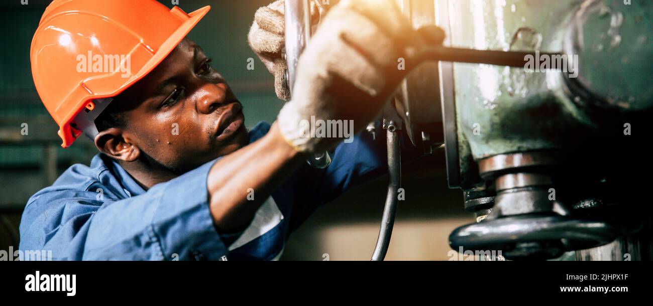 engineer industry African man worker working and check on machine in ...