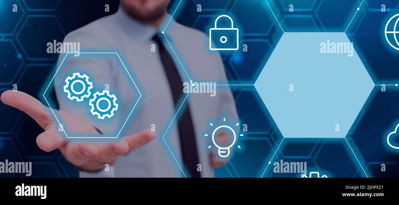 Businessman Extending Hand And Showing Digital Symbols And Settings In An Abstract Hexagon ...
