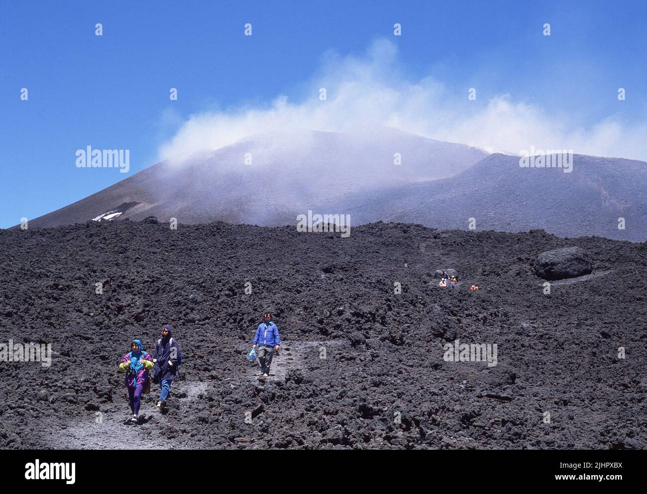 Walkers near Mount Etna summit, Sicily Stock Photo - Alamy
